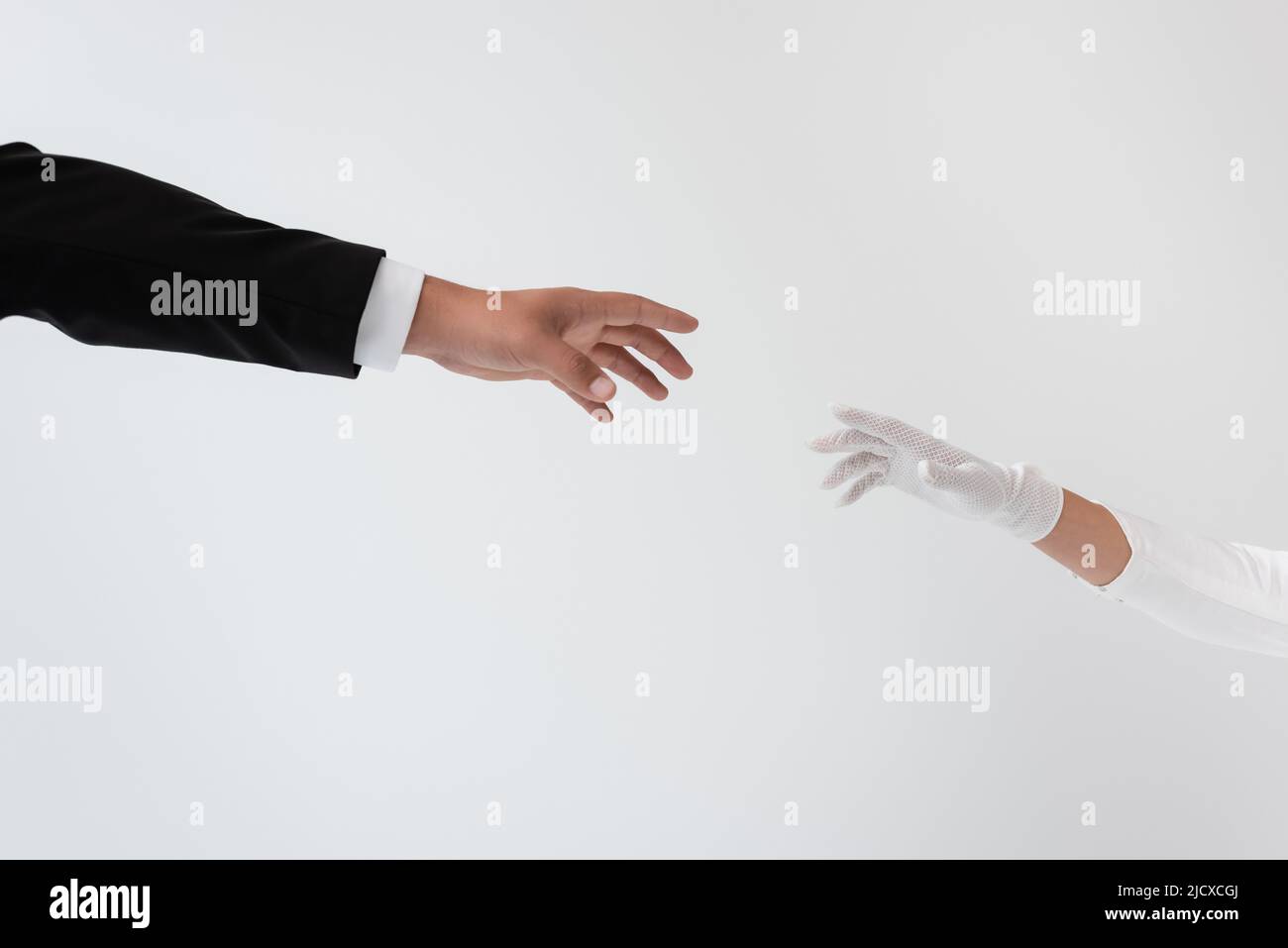 Young couple reaching hands hi-res stock photography and images - Alamy