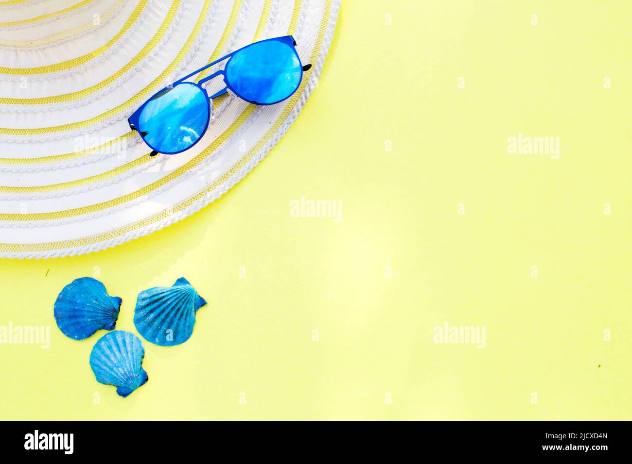 Travel vacation background. Sun glasses sea shells bright yellow ...