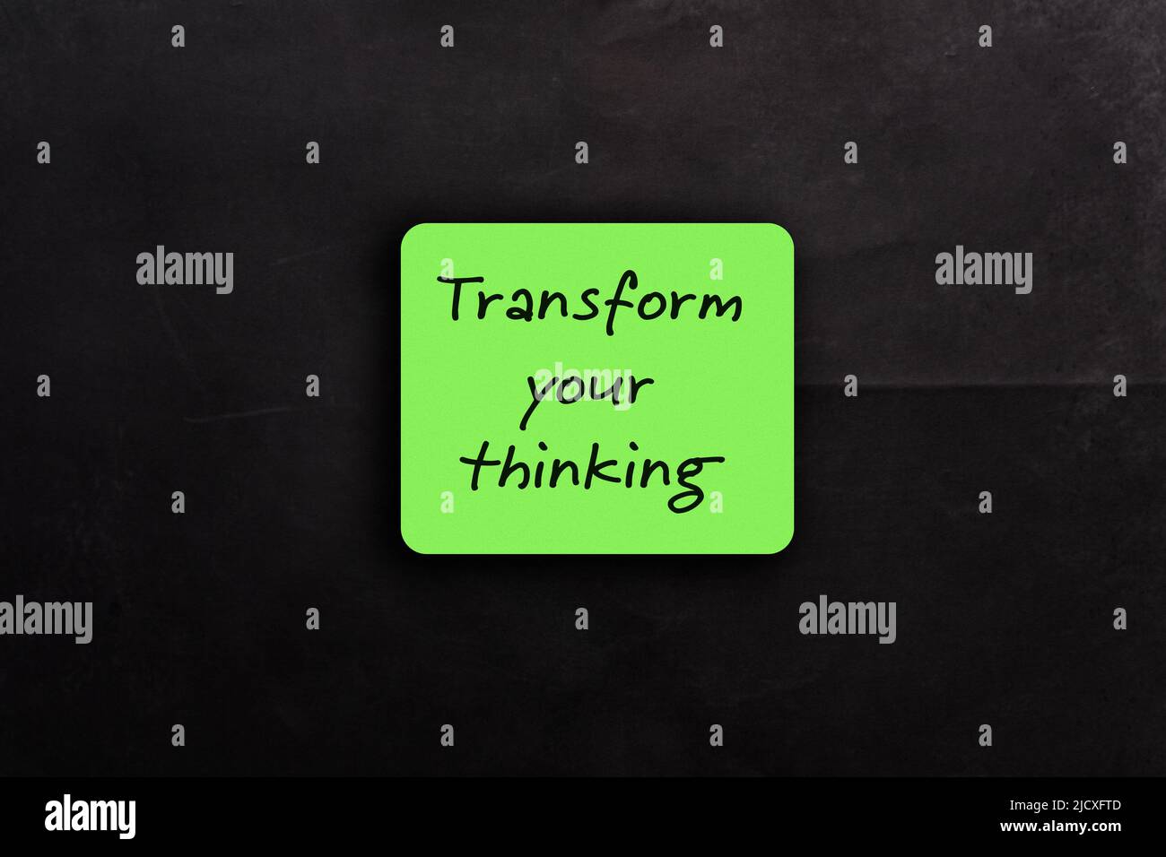 Green card with words Transform your Thinking on black Stock Photo - Alamy