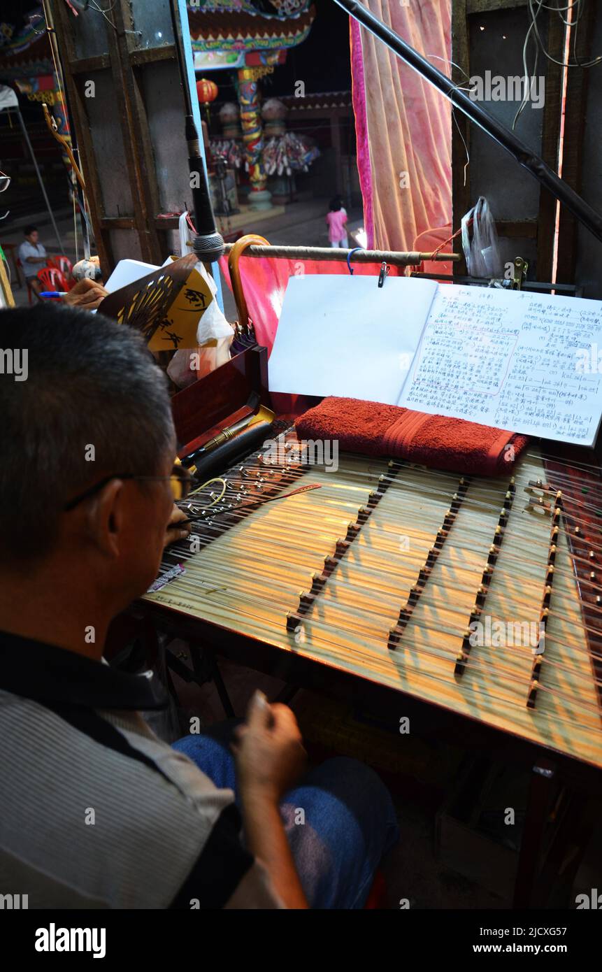 Thai people of chinese descent playing musical instruments sing song ...