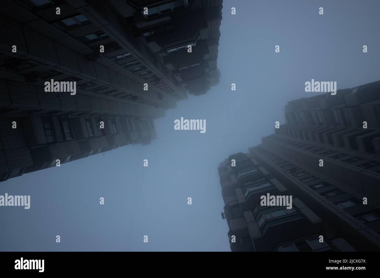 Two tall residential buildings in the form of a tower, immersed in a ...