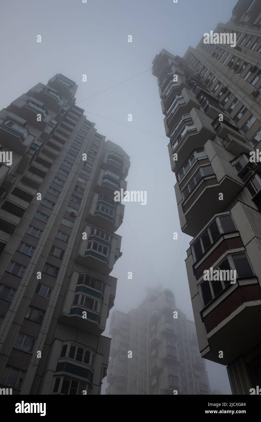 Two tall residential buildings in the form of a tower, immersed in a ...