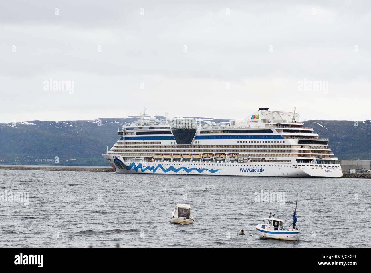 AIDAluna in Alta harbor June 2022 with still snow on mountain peaks in ...