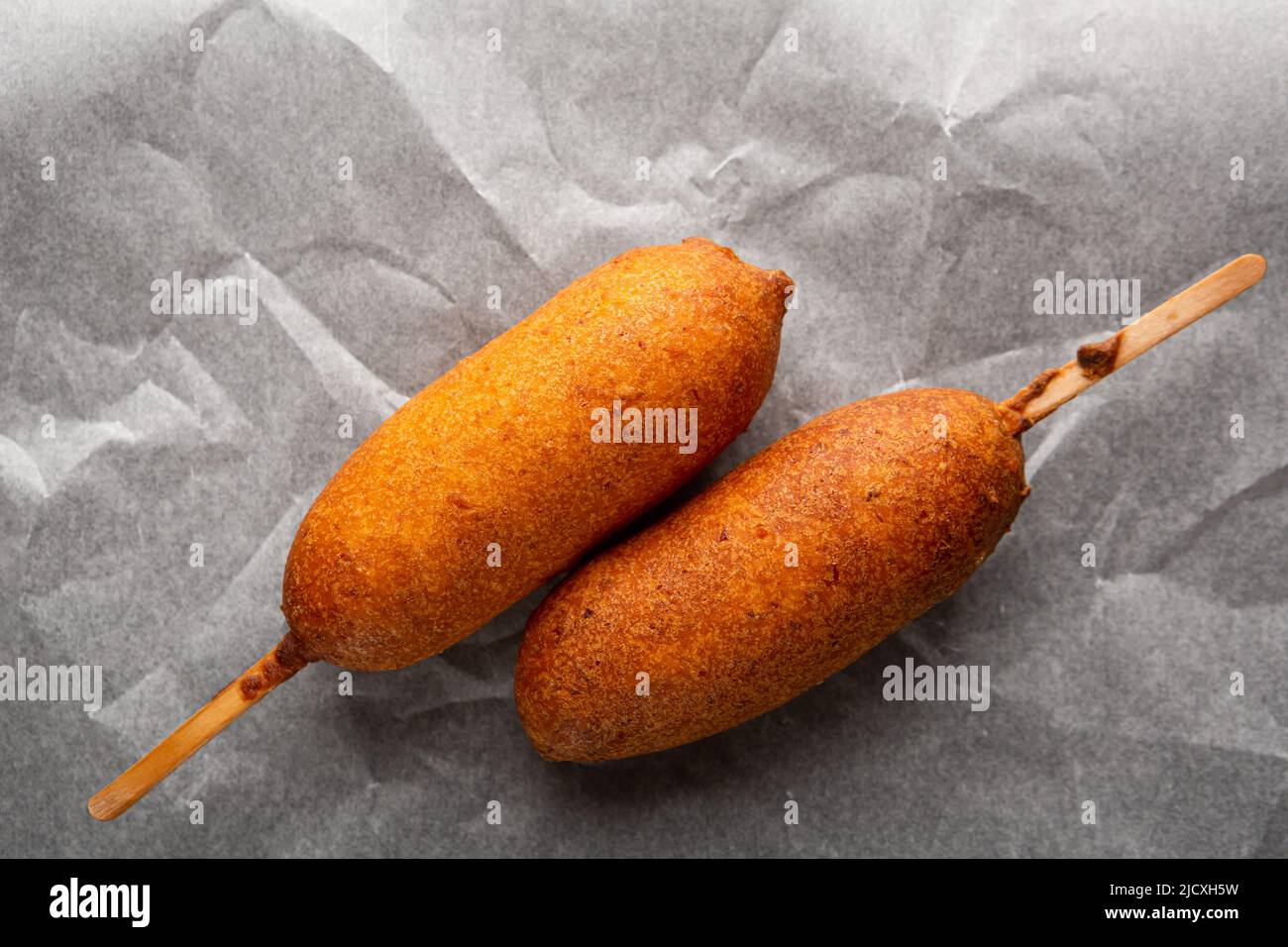 Overhead view of two corn dog street food Stock Photo - Alamy
