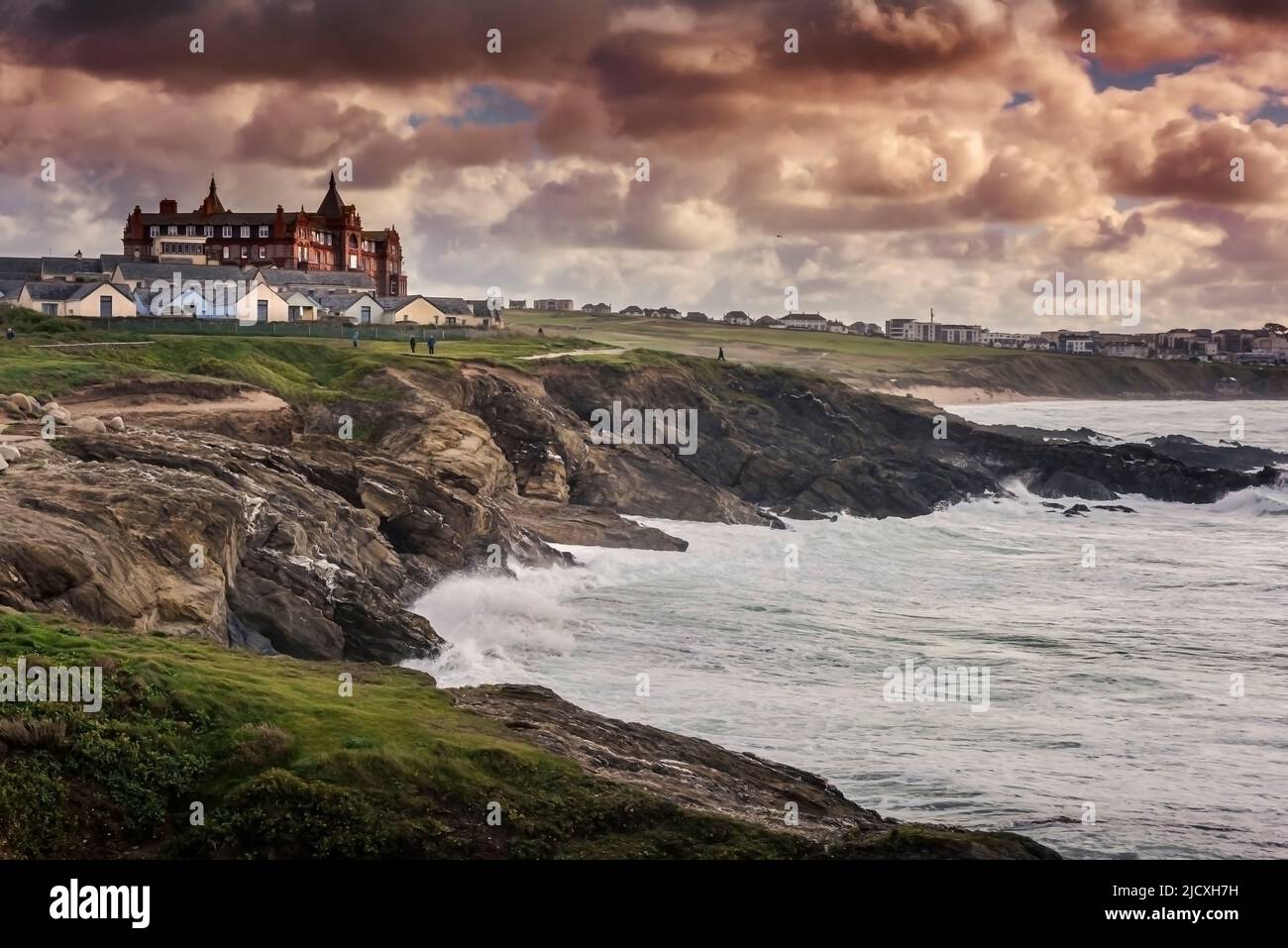 Rough sea and the wild rocky coastline of the iconic Fistral Bay in ...