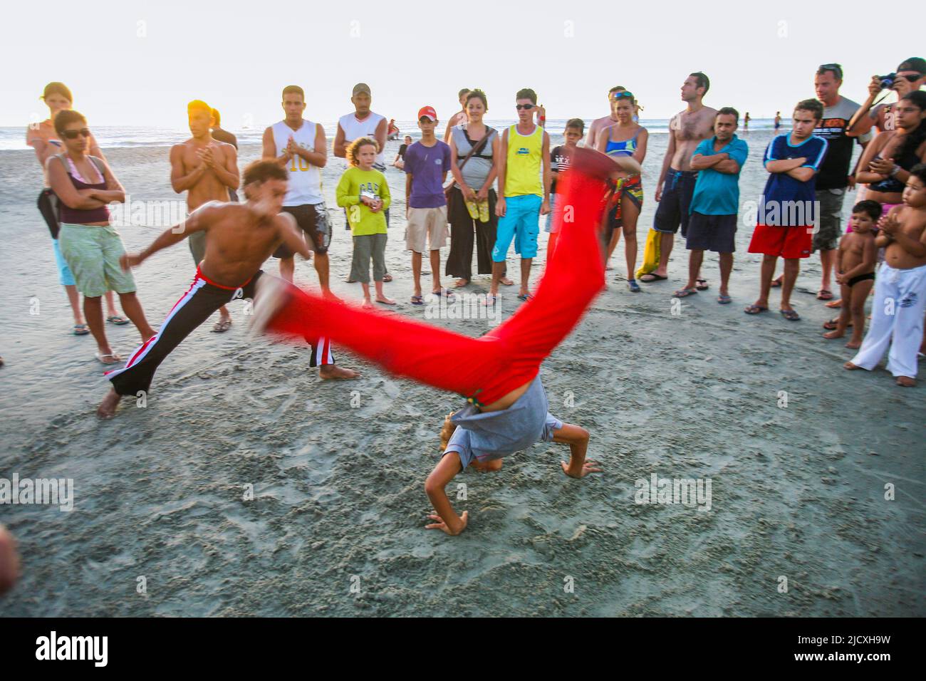 Brazil, Jericoacoara People doing capoeira on the beach, a kind of ...
