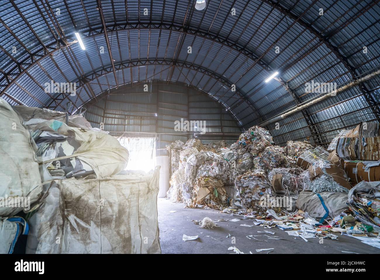 Waste paper sorting and filing for processing at paper recycling plant ...