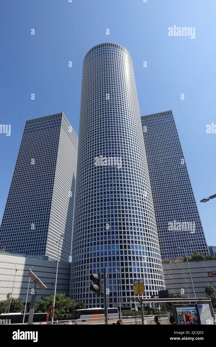 Very tall round skyscraper in sun beams Stock Photo - Alamy