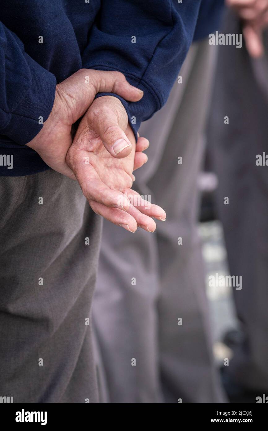 With hands clasped behind his back hi-res stock photography and images ...