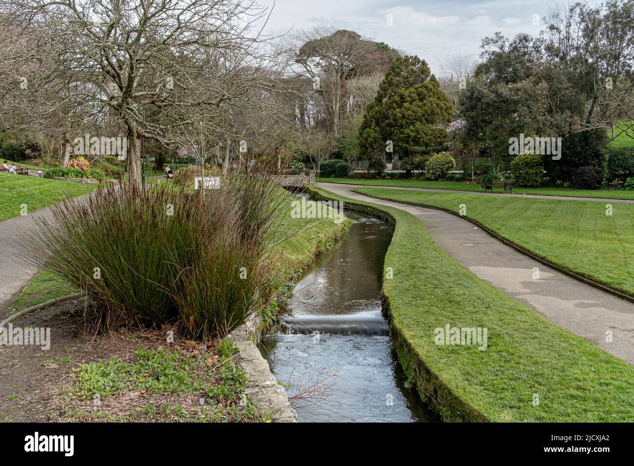 A small river stream flowing through the historic Trenance Gardens in ...