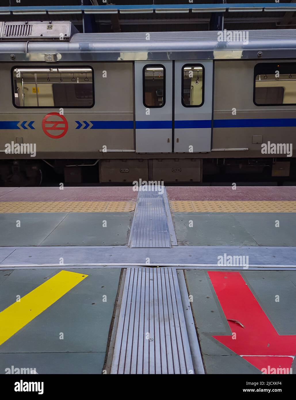 isolated train standing at vacant metro station at day from flat angle ...