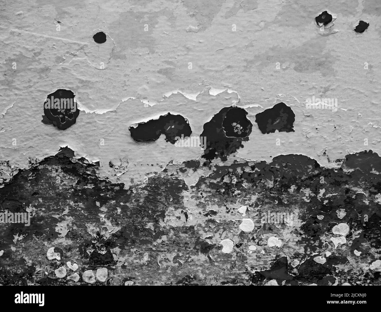 Format-filling view of a metal wall with chipped blue paint in various ...
