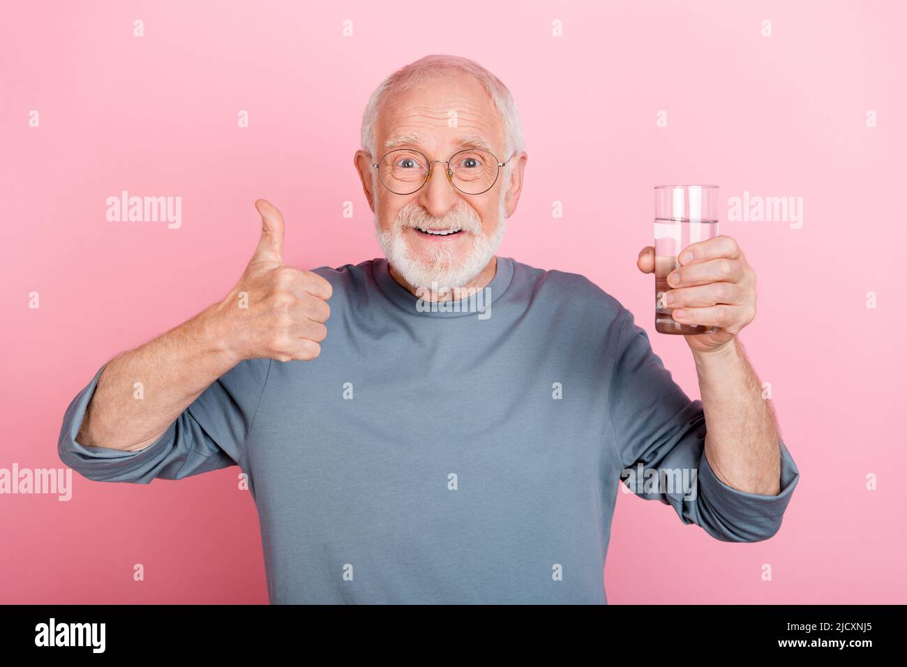 Photo of funny aged grey hairdo man hold water thumb up wear eyewear ...