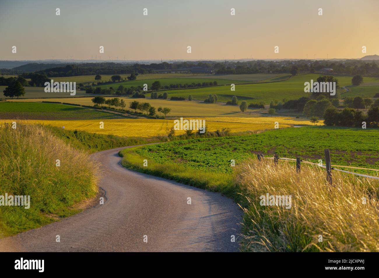 A golden sunset over the rolling hills of south Limburg in the ...