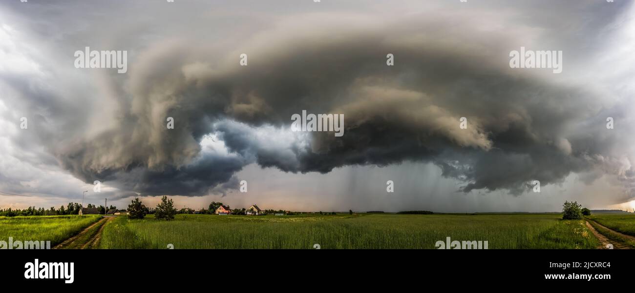 Storm clouds over field, extreme weather, dangerous storm Stock Photo ...