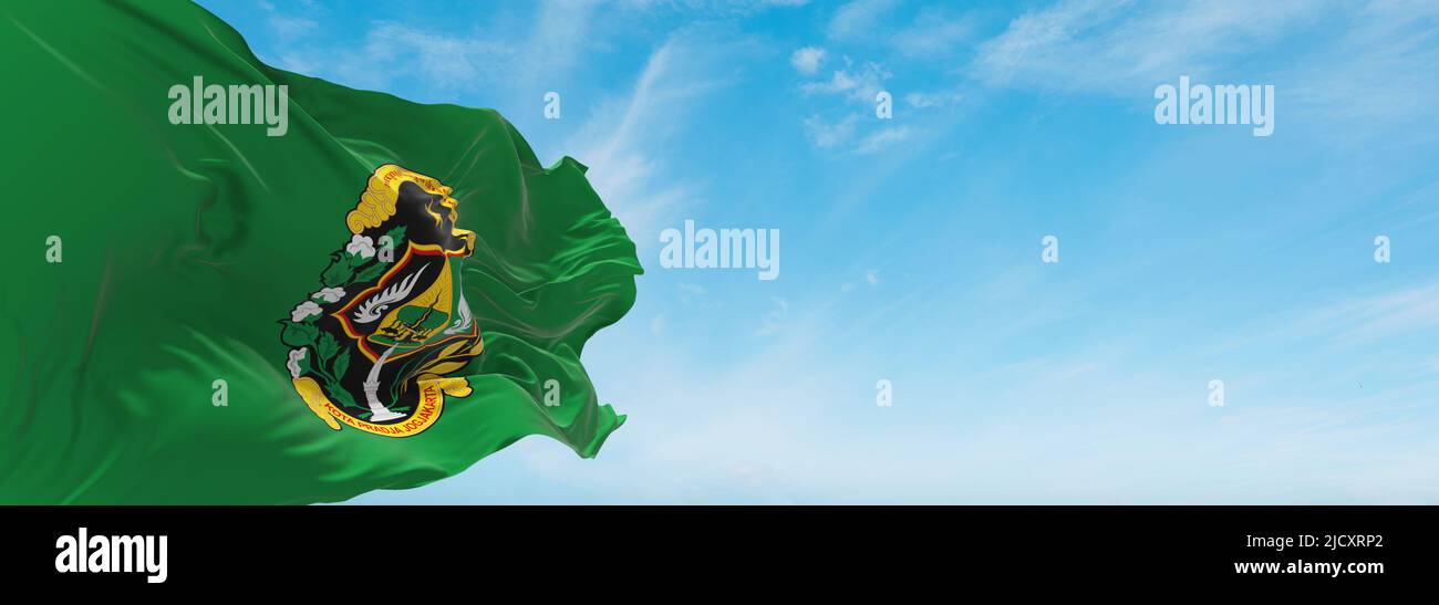 official flag of Yogyakarta City Indonesia at cloudy sky background on ...
