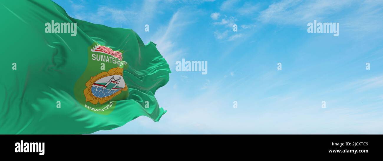 official flag of South Sumatra Indonesia at cloudy sky background on ...