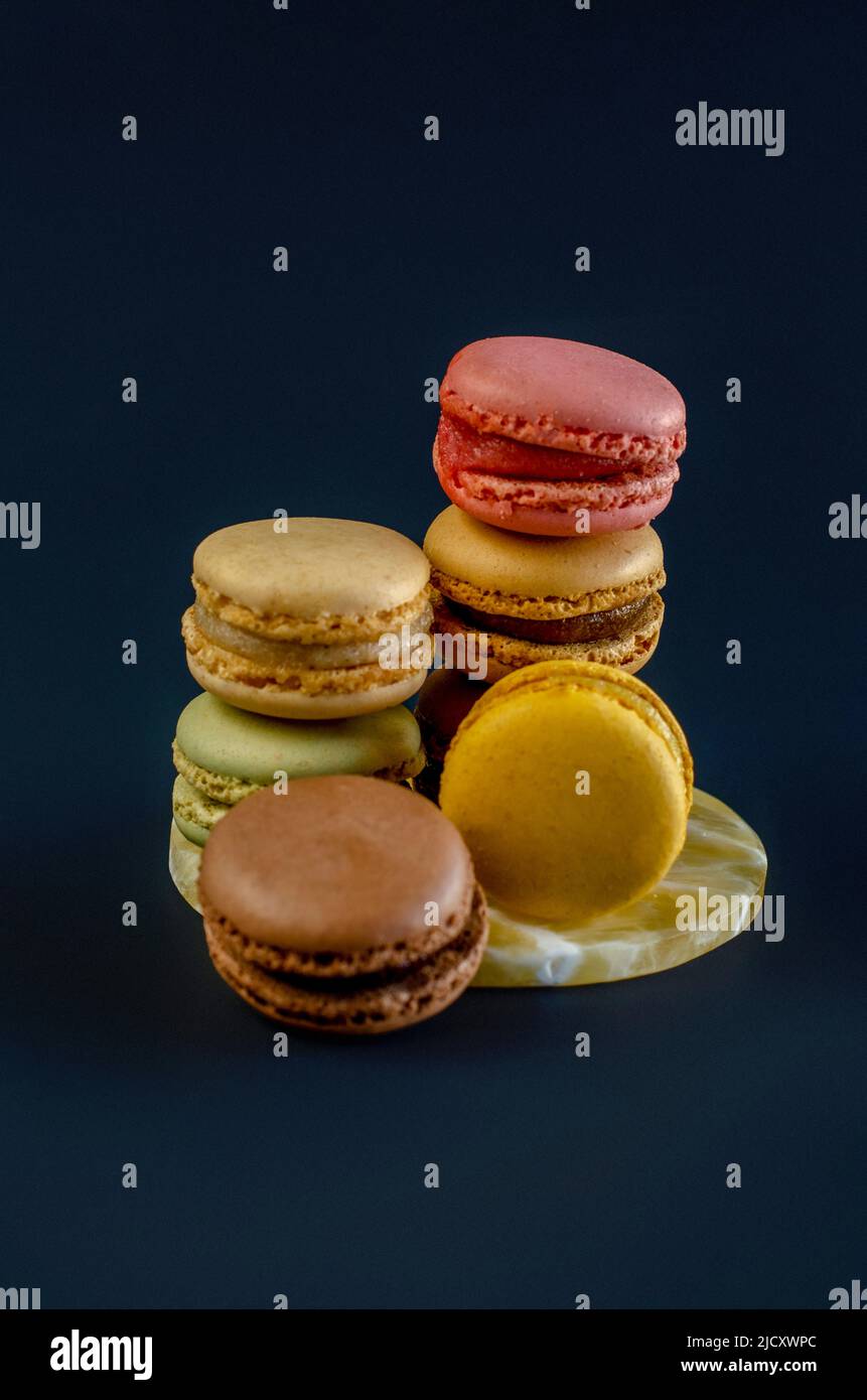 Row of delicious colorful French macaroons of different flavors on ...