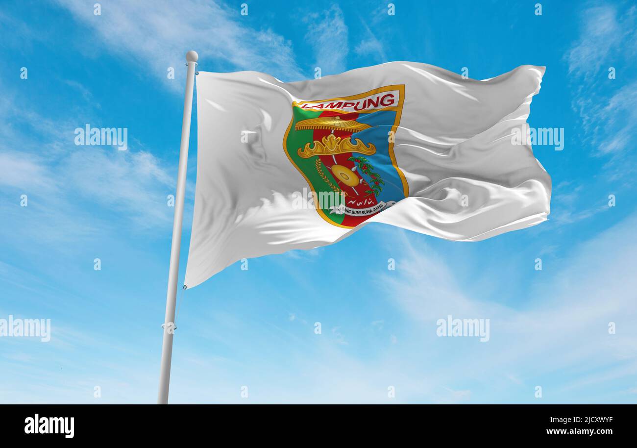 official flag of Lampung Indonesia at cloudy sky background on sunset ...