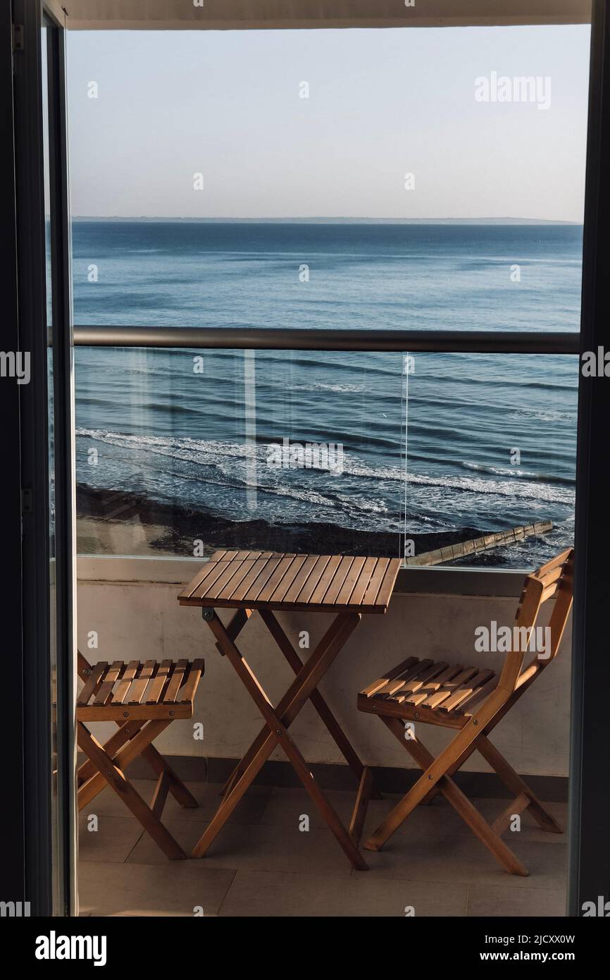 Cozy place at the balcony with sea background Stock Photo - Alamy