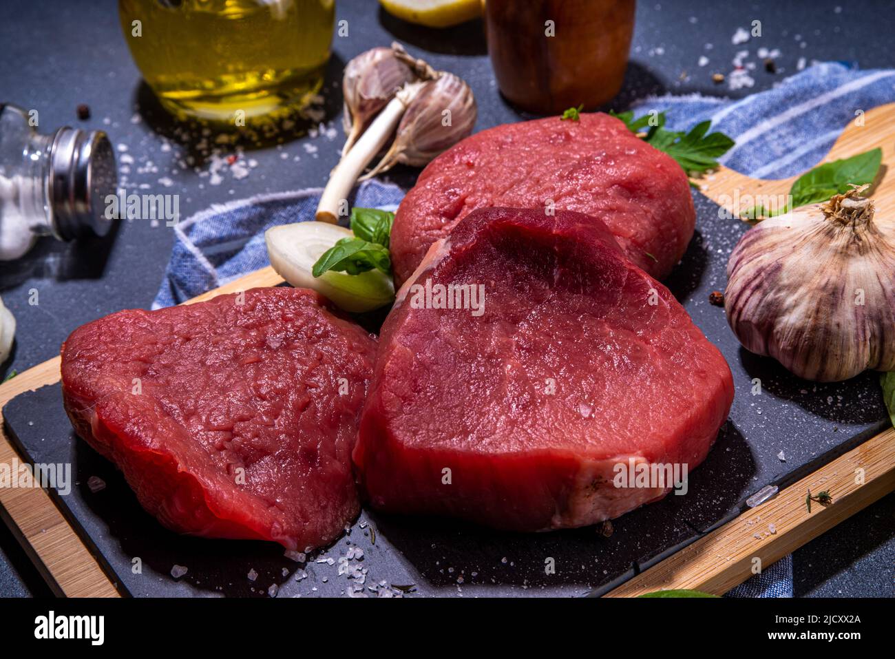 Raw beef steak filet with spices for cooking. Beef steak red meat cooking background copy space ...