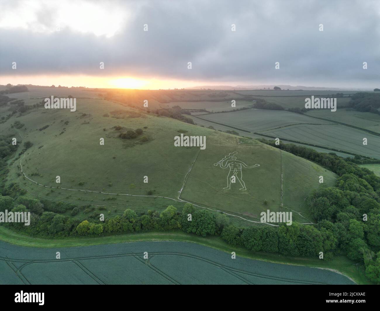 Cerne abbas giant chalk Hill figure sunrise landscape. Wessex Ridgeway ...