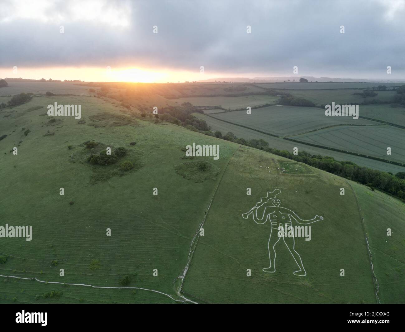 Cerne abbas giant chalk Hill figure sunrise landscape. Wessex Ridgeway ...