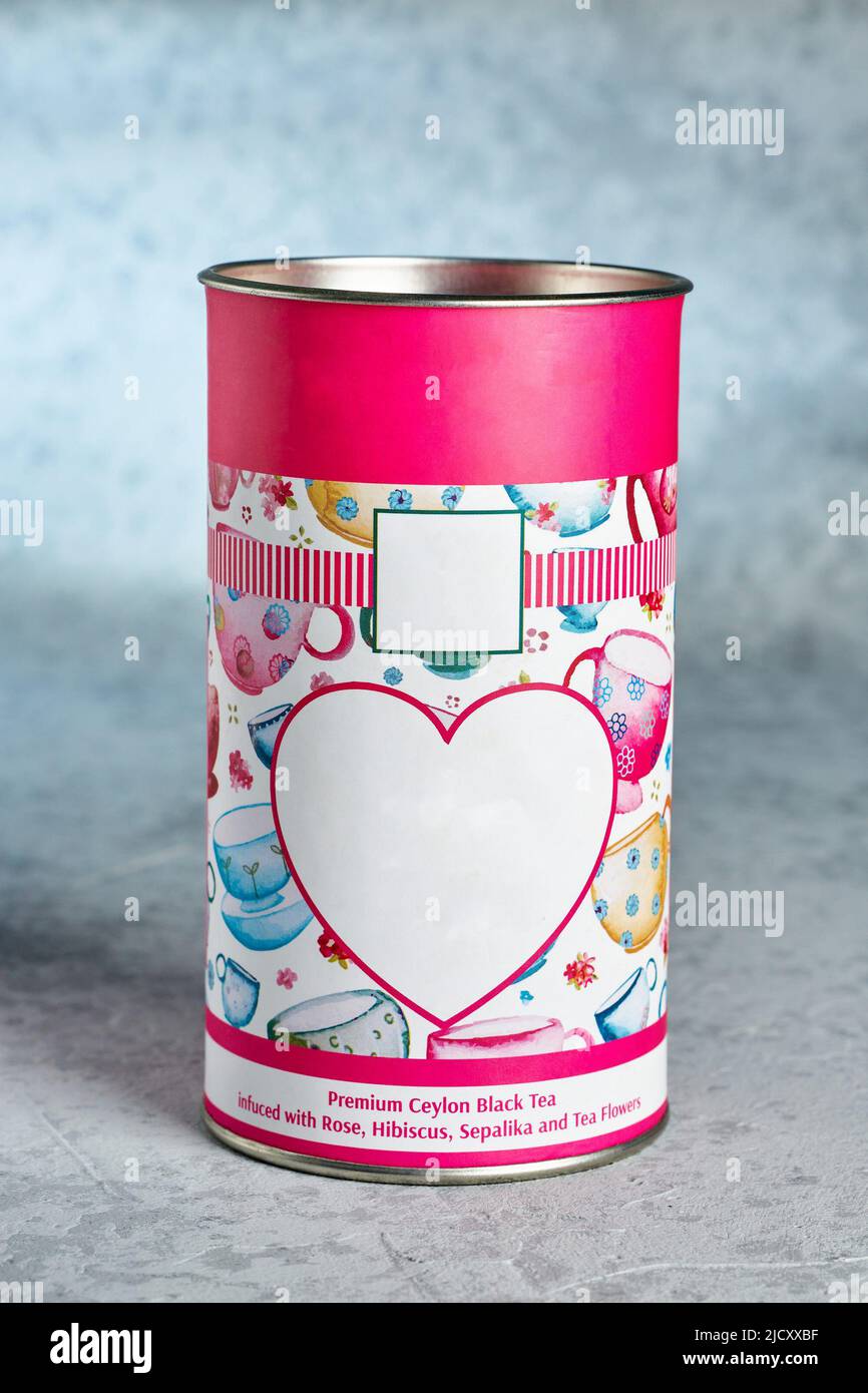 Pink tea jar with heart on gray background Stock Photo - Alamy