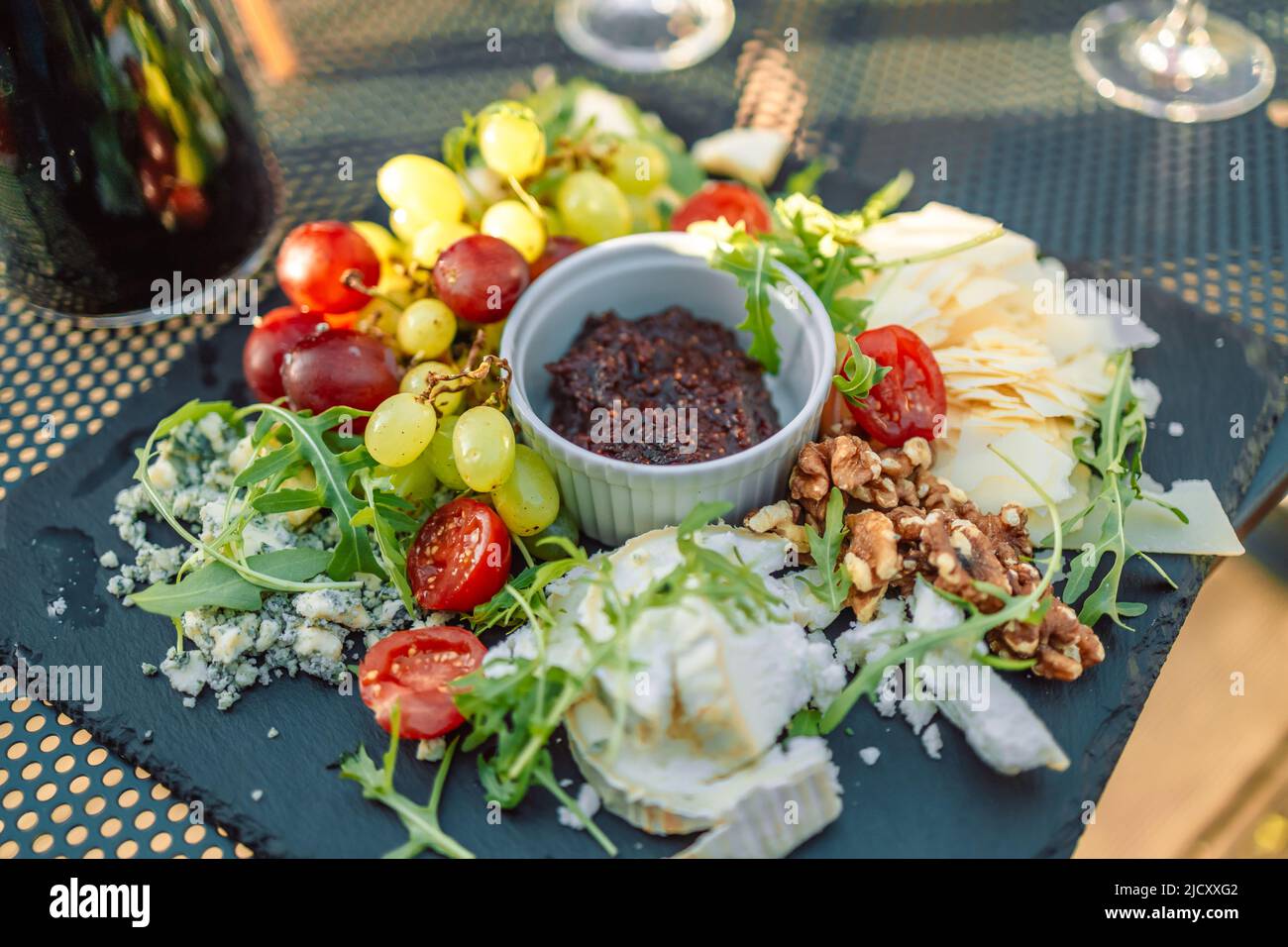 Cheese board. Cheese platter: Parmesan, maasdam, camembert, cheddar ...