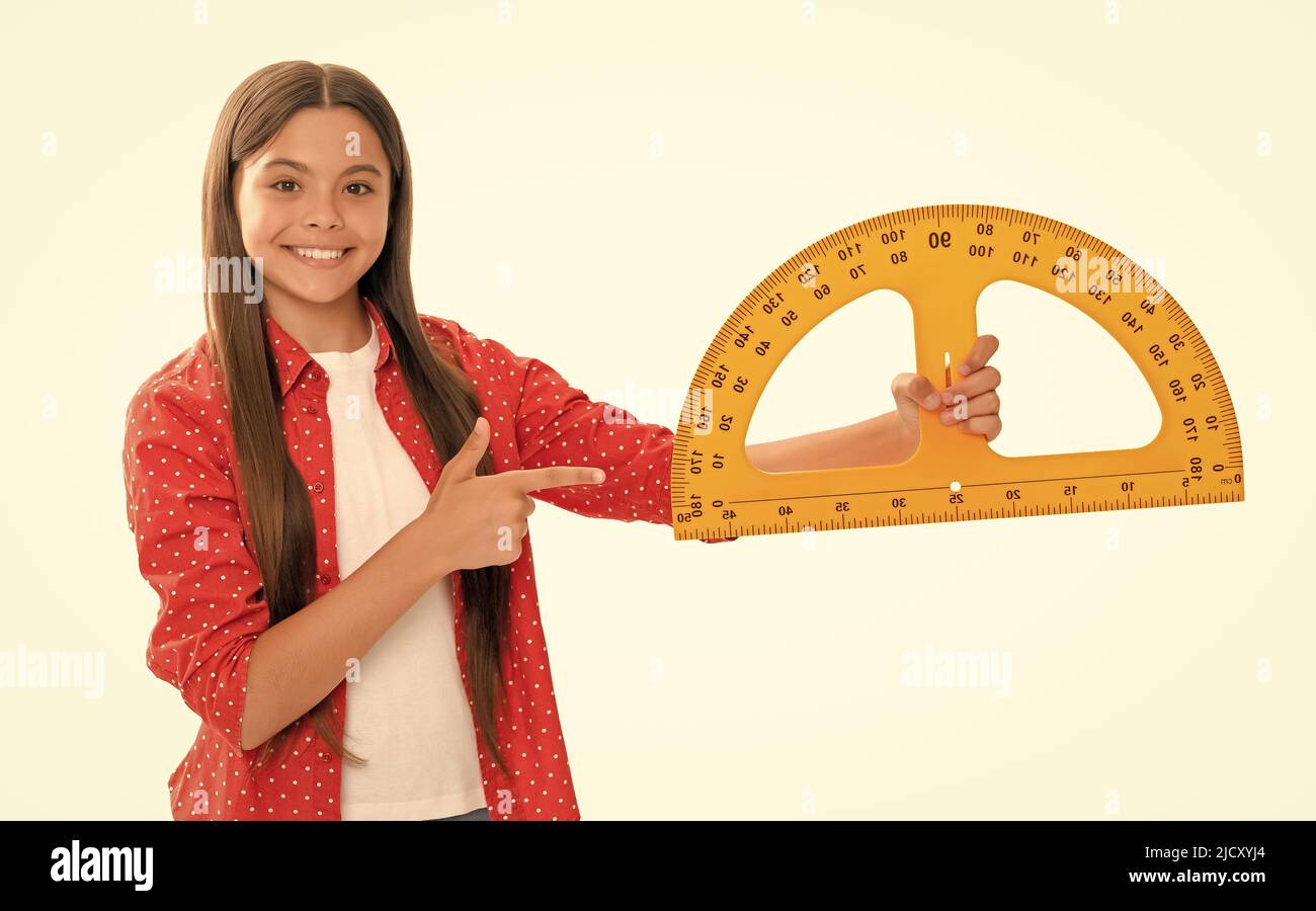 happy teen girl pointing finger on protractor study math at school ...