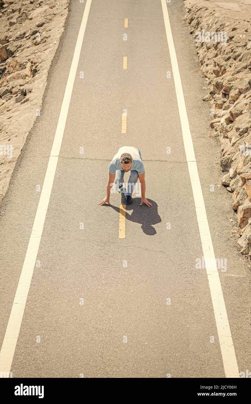 healthy lifestyle. mature man on road start. sport activity. full of ...