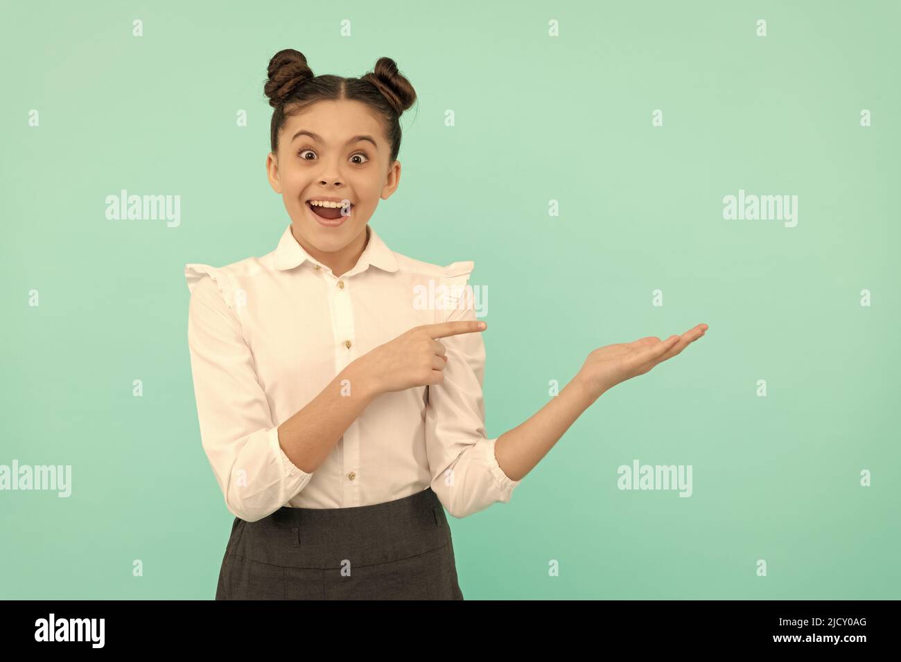 Back to school discount only for you. Happy kid point finger at open ...