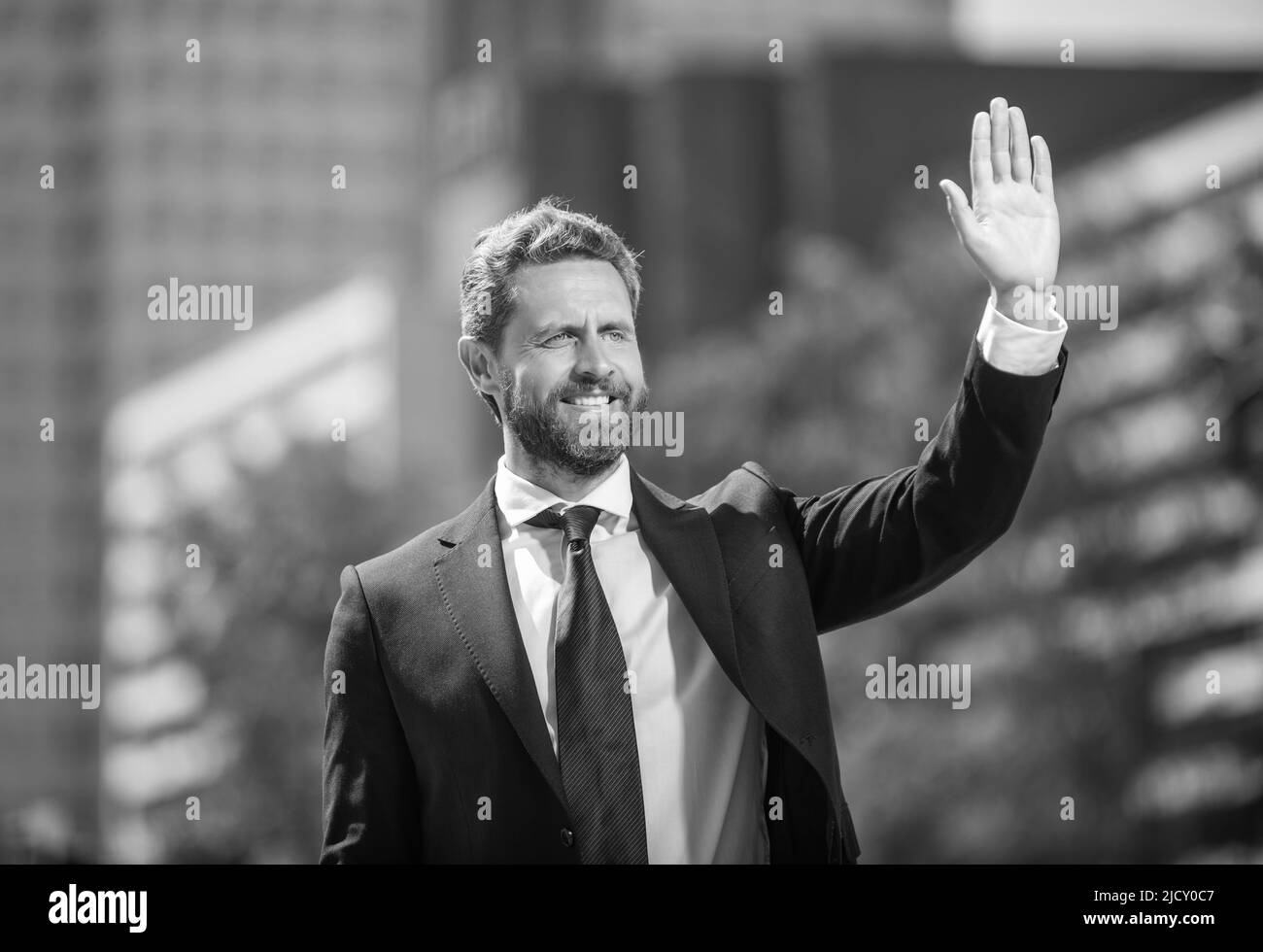 confident bearded boss. cheerful businessman in formalwear waving hello ...