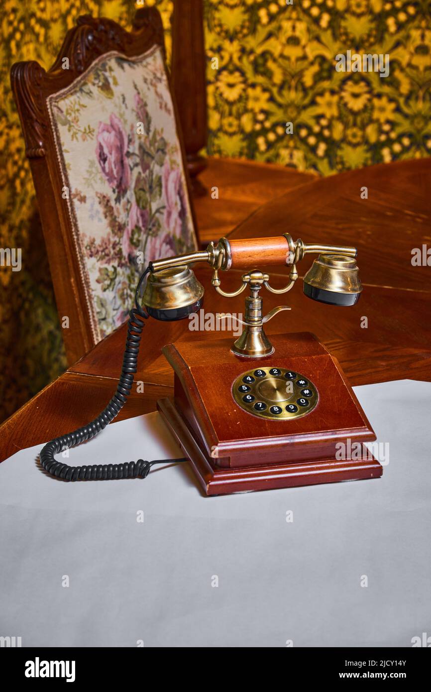 Man's hand picks up the phone on an old phone Stock Photo - Alamy