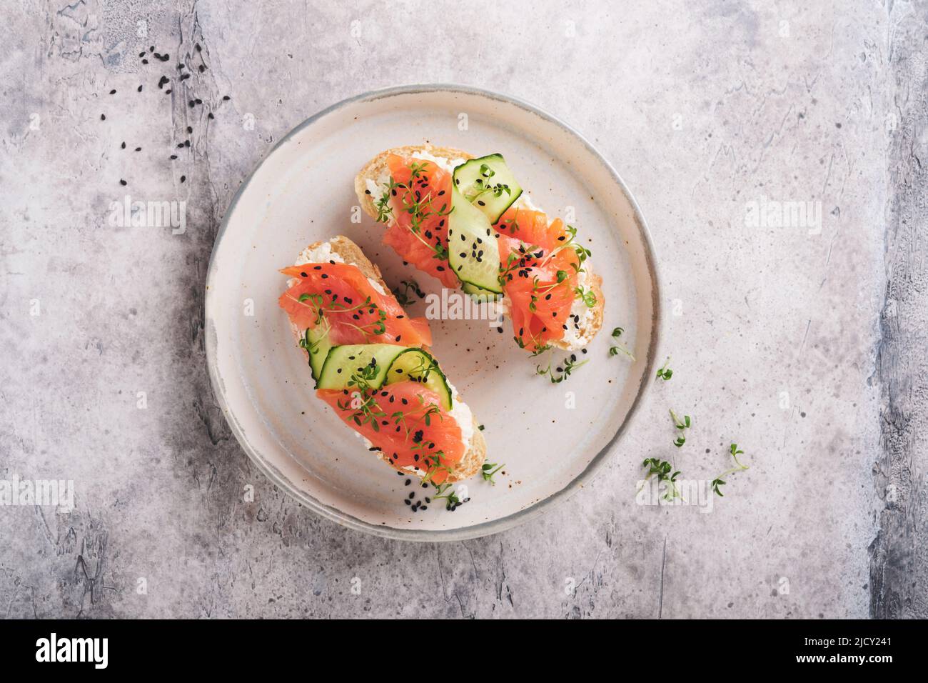 Sandwiches. Salmon toast with cream cheese, cucumber, black sesame and ...