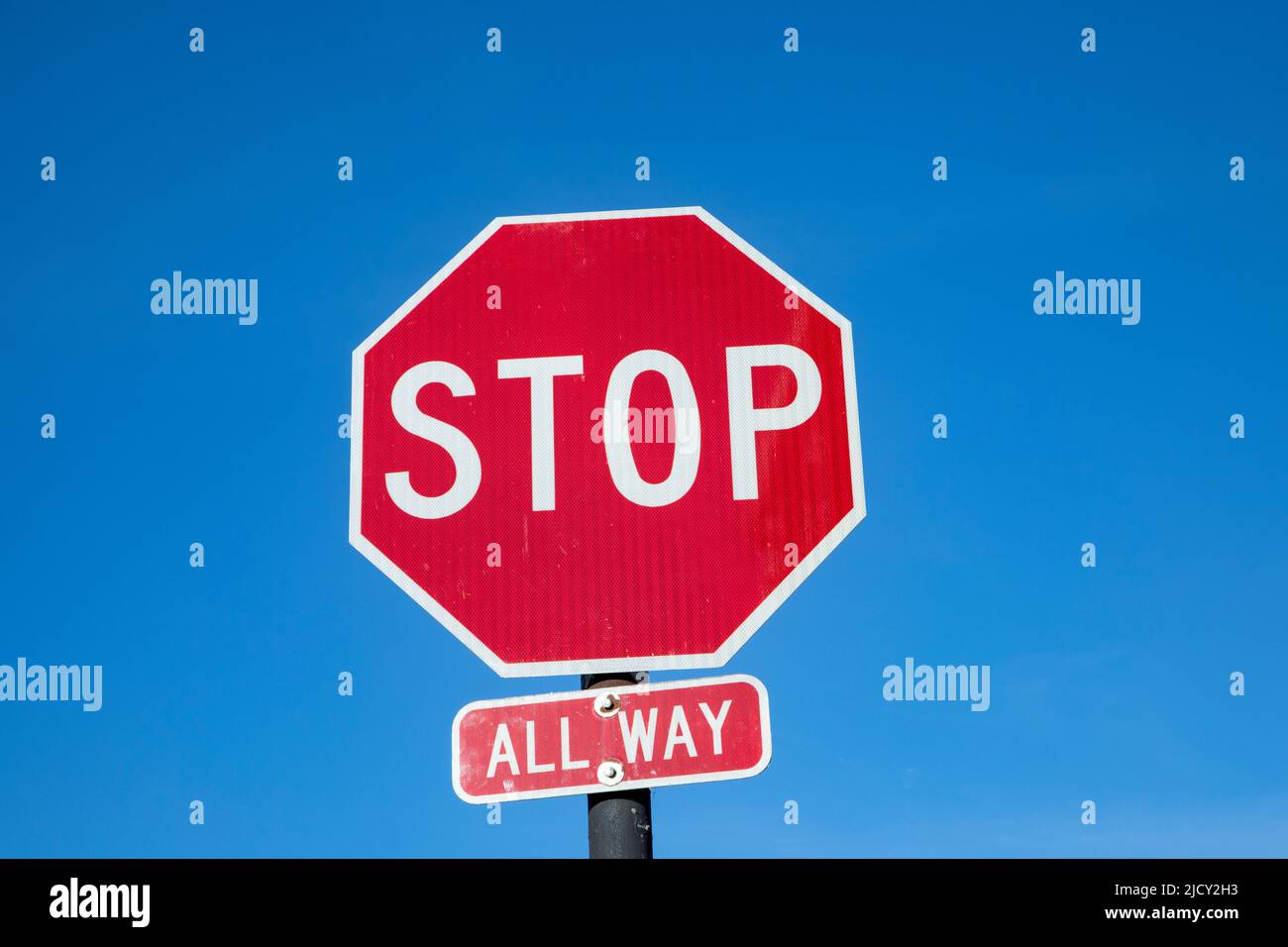 Stop sign under blue sky in USA with all way addition, USA Stock Photo ...