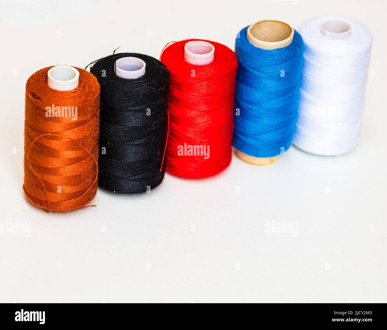 colorful spools of sewing thread isolated on white background Stock ...