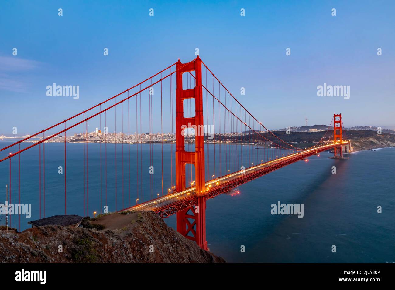 golden gate bridge in San Francisco in dawn with lights Stock Photo - Alamy