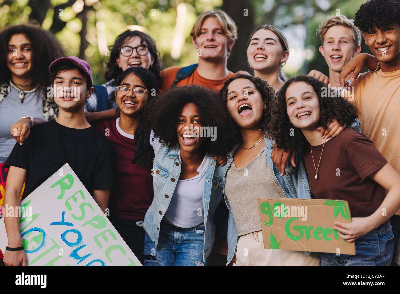 Group of multicultural teenagers smiling happily while standing ... Group of multicultural teenagers smiling happily while standing ...
