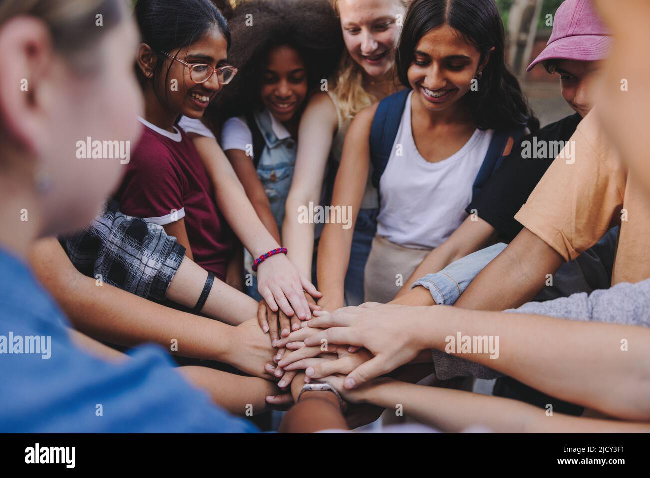 Team Huddle Hands Up Girls