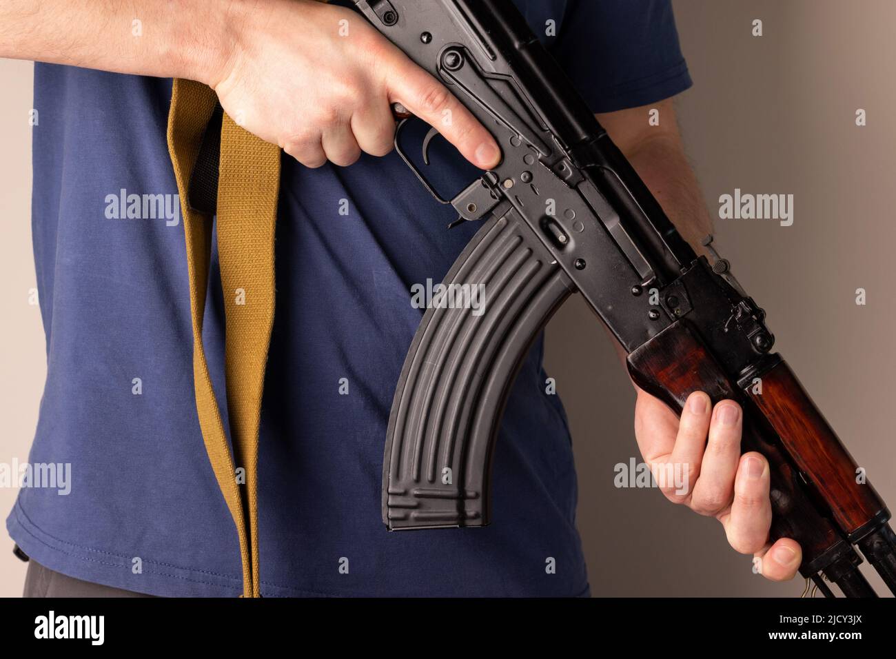 Man with Kalashnikov assault rifle closeup Stock Photo - Alamy