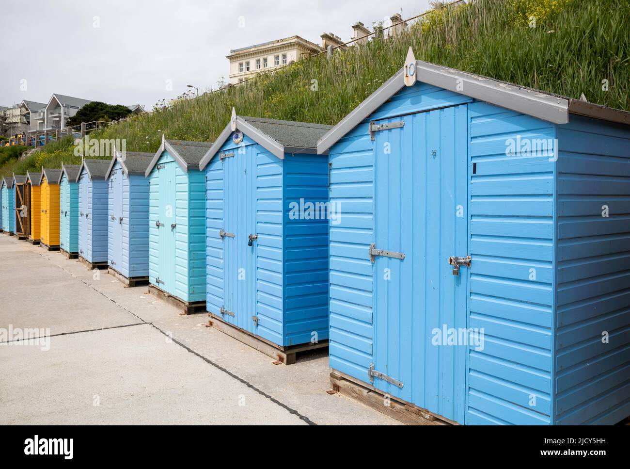 Colourful Beach huts along the front at Pendennis Castle Beach in ...