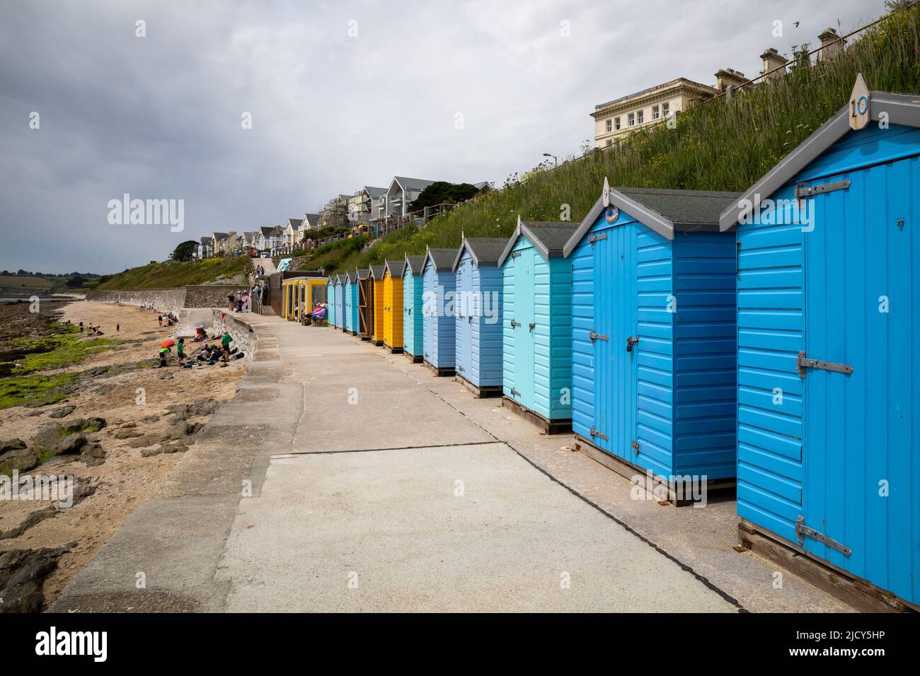 Colourful Beach huts along the front at Pendennis Castle Beach in ...