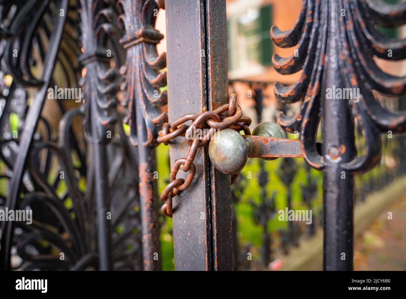 Chained Iron Gate at an urban historical property Stock Photo - Alamy
