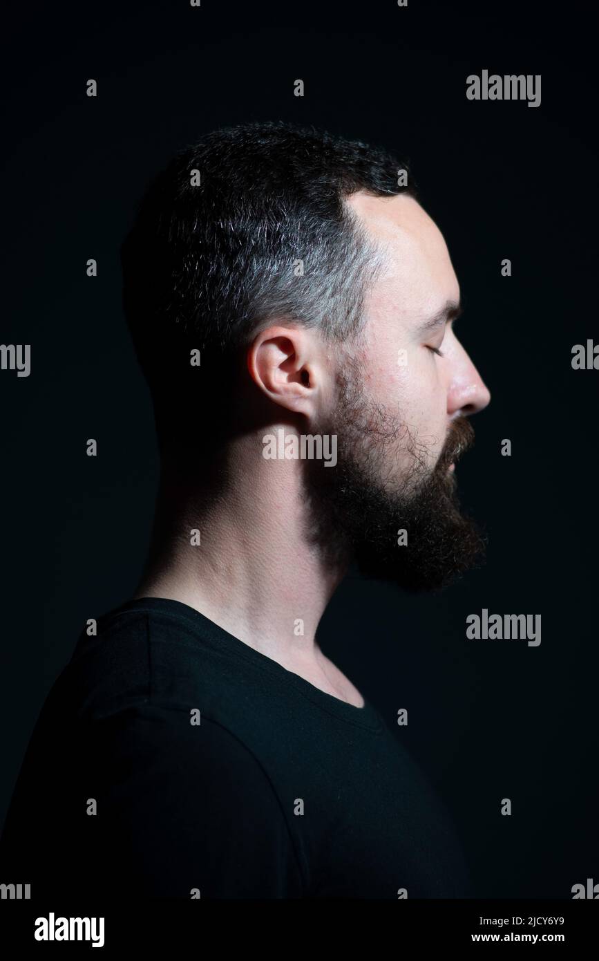 Studio low key profile portrait hi-res stock photography and images - Alamy