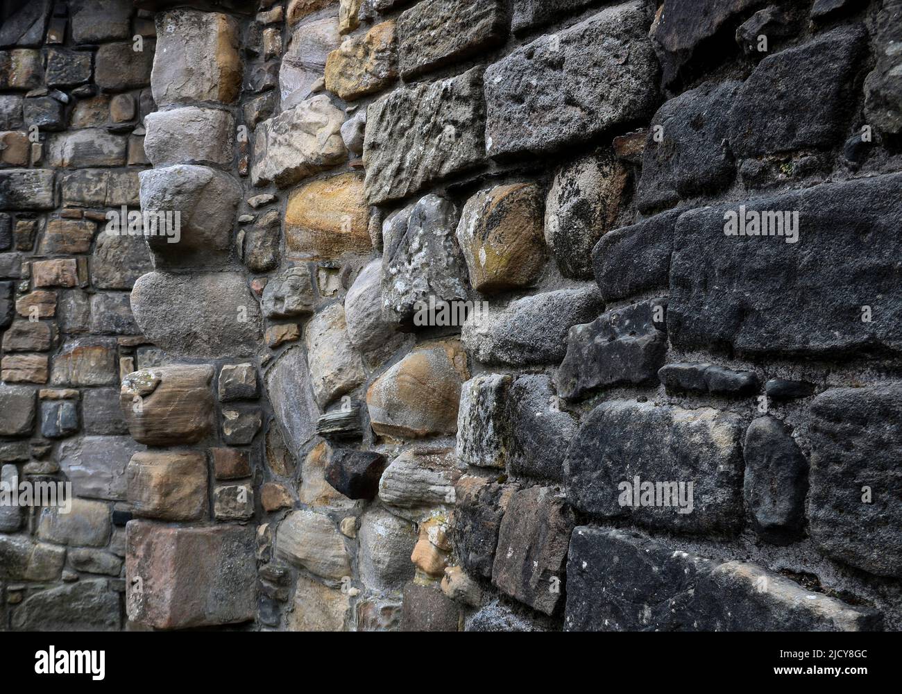 Medieval stone wall closeup for background Stock Photo - Alamy