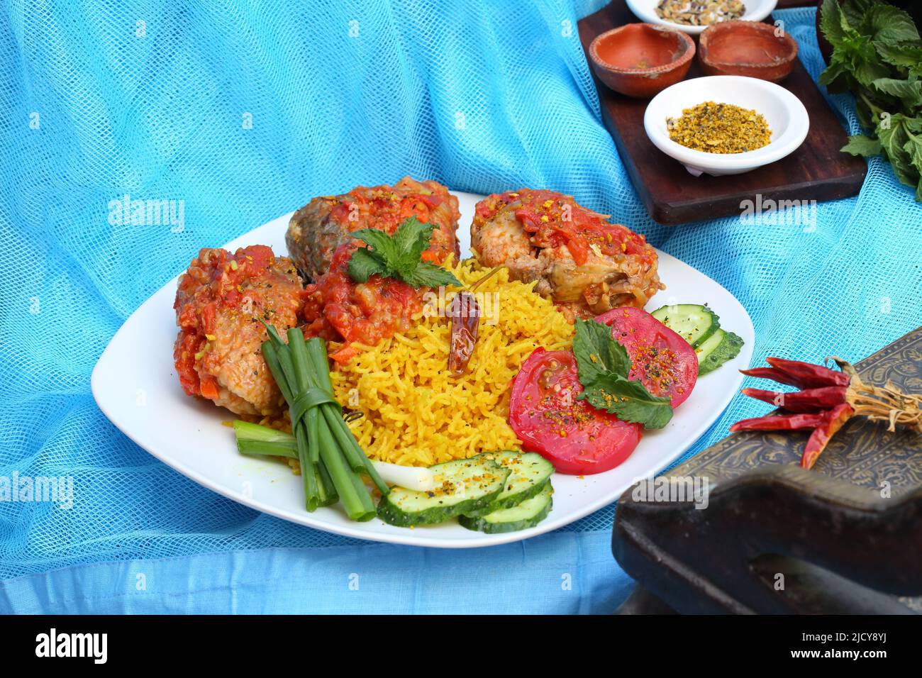 Fried fish in tomato sauce with basmati rice. Indian food Stock Photo ...