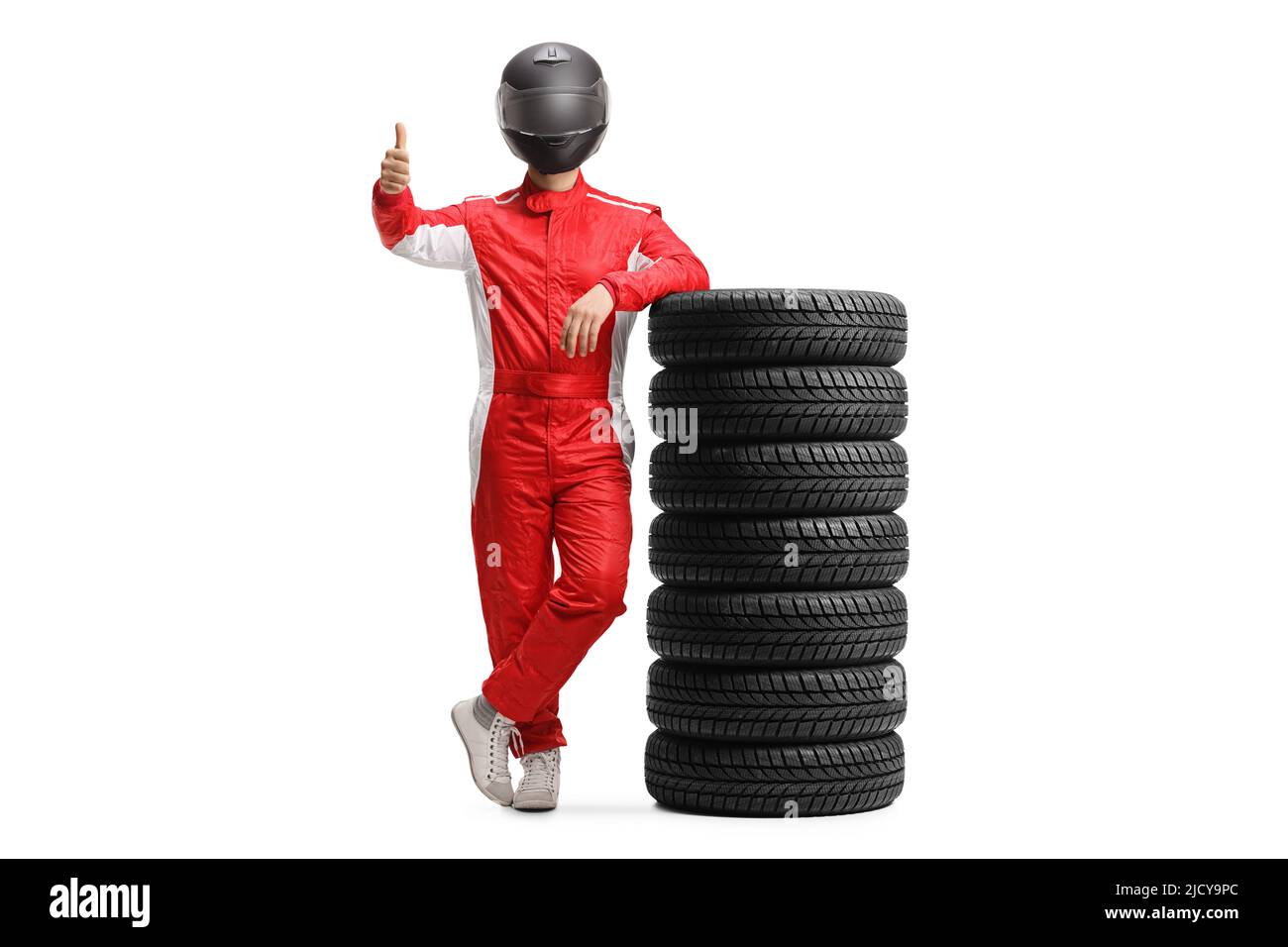 Full length portrait of a motorsport racer in a red suit leaning on a ...