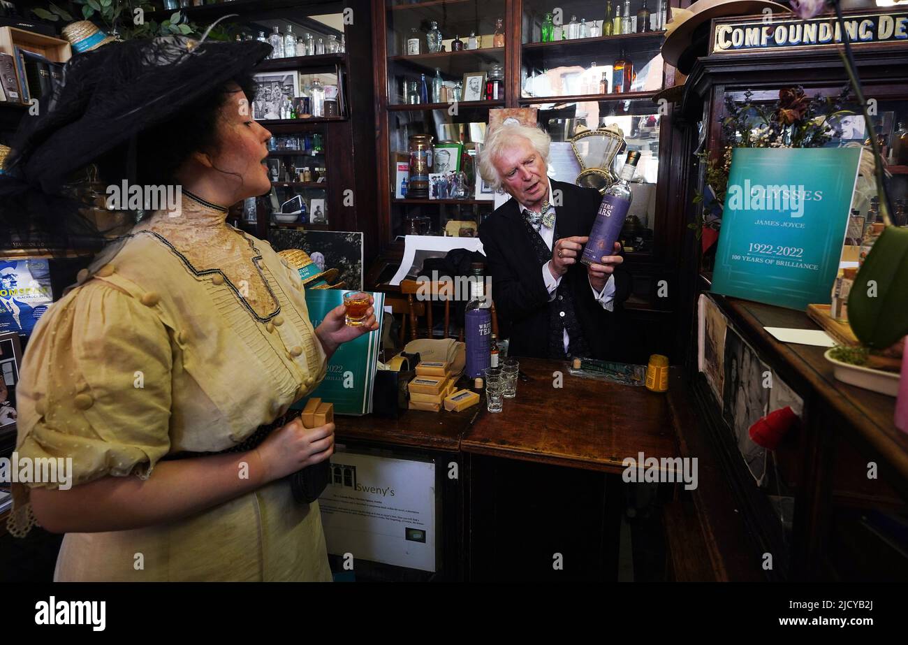PJ Murphy displays a bottle of Writer's Tears whiskey to Lizzie Gaskill ...