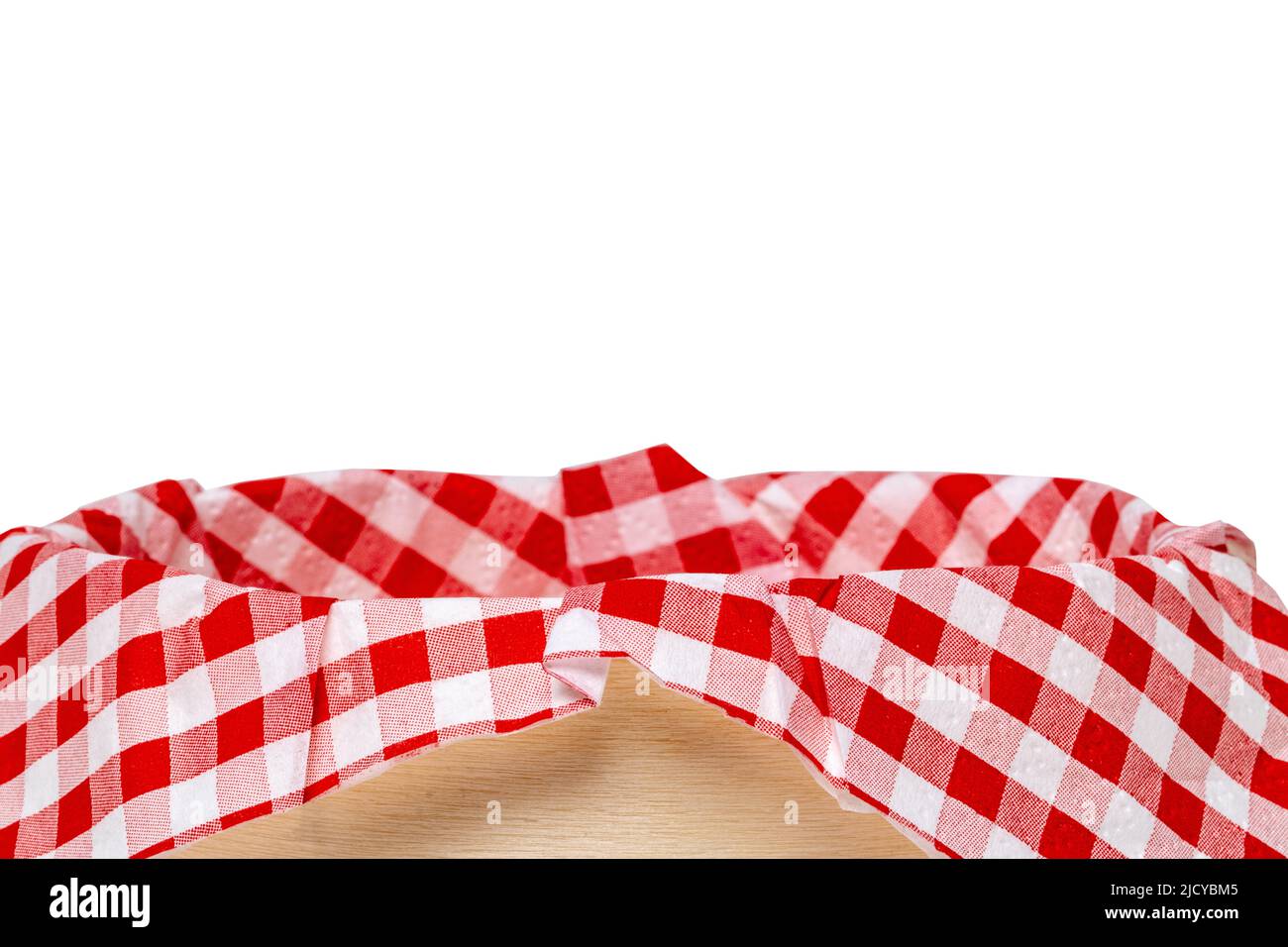 Empty picnic basket. Close-up of a empty straw basket therein a red ...